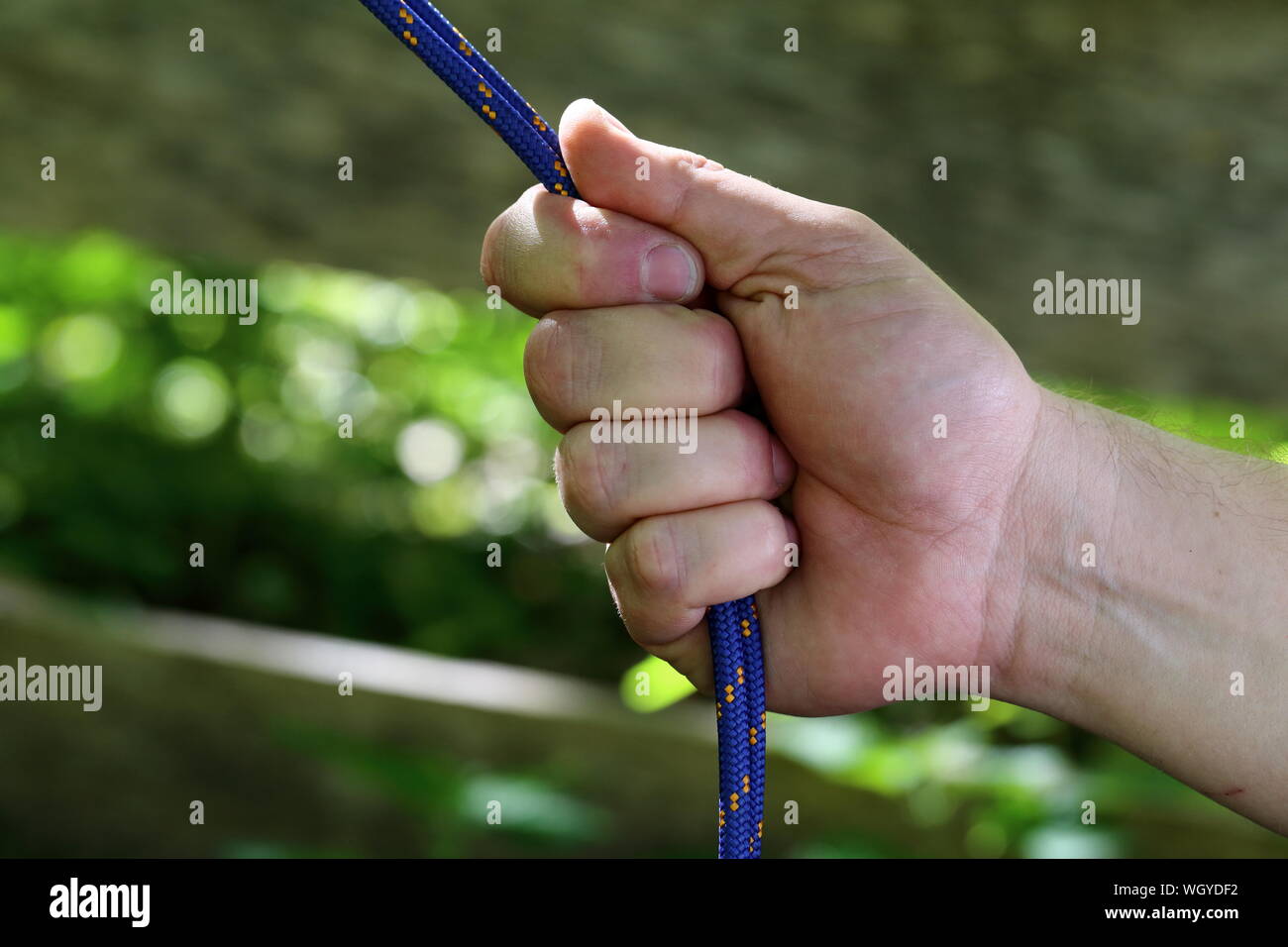 Hand holding rope hi-res stock photography and images - Alamy
