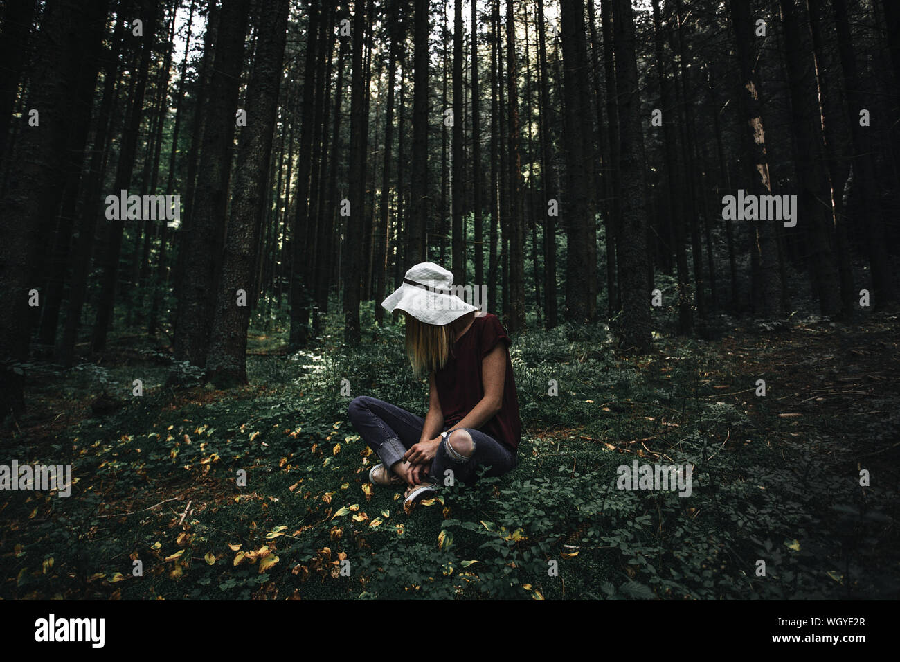 Woman Sitting Against Tree Trunk High Resolution Stock Photography and ...