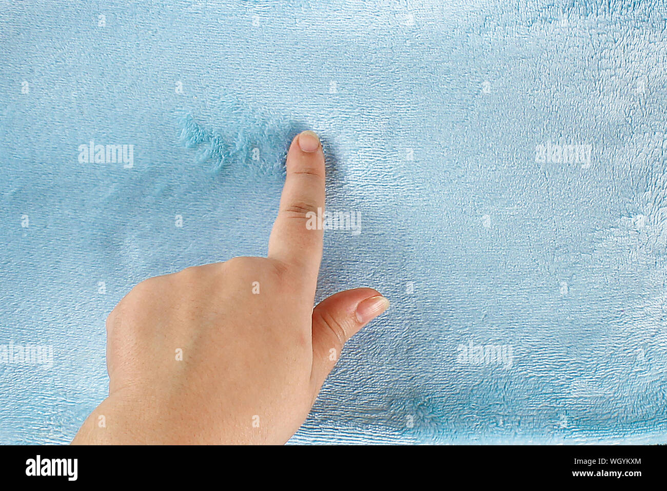 Hand touches the fabric. The concept of touch, tactility, feelings ...