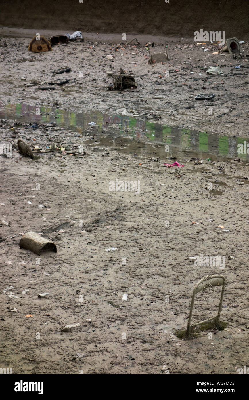 Garbage in mud puddle hi-res stock photography and images - Alamy