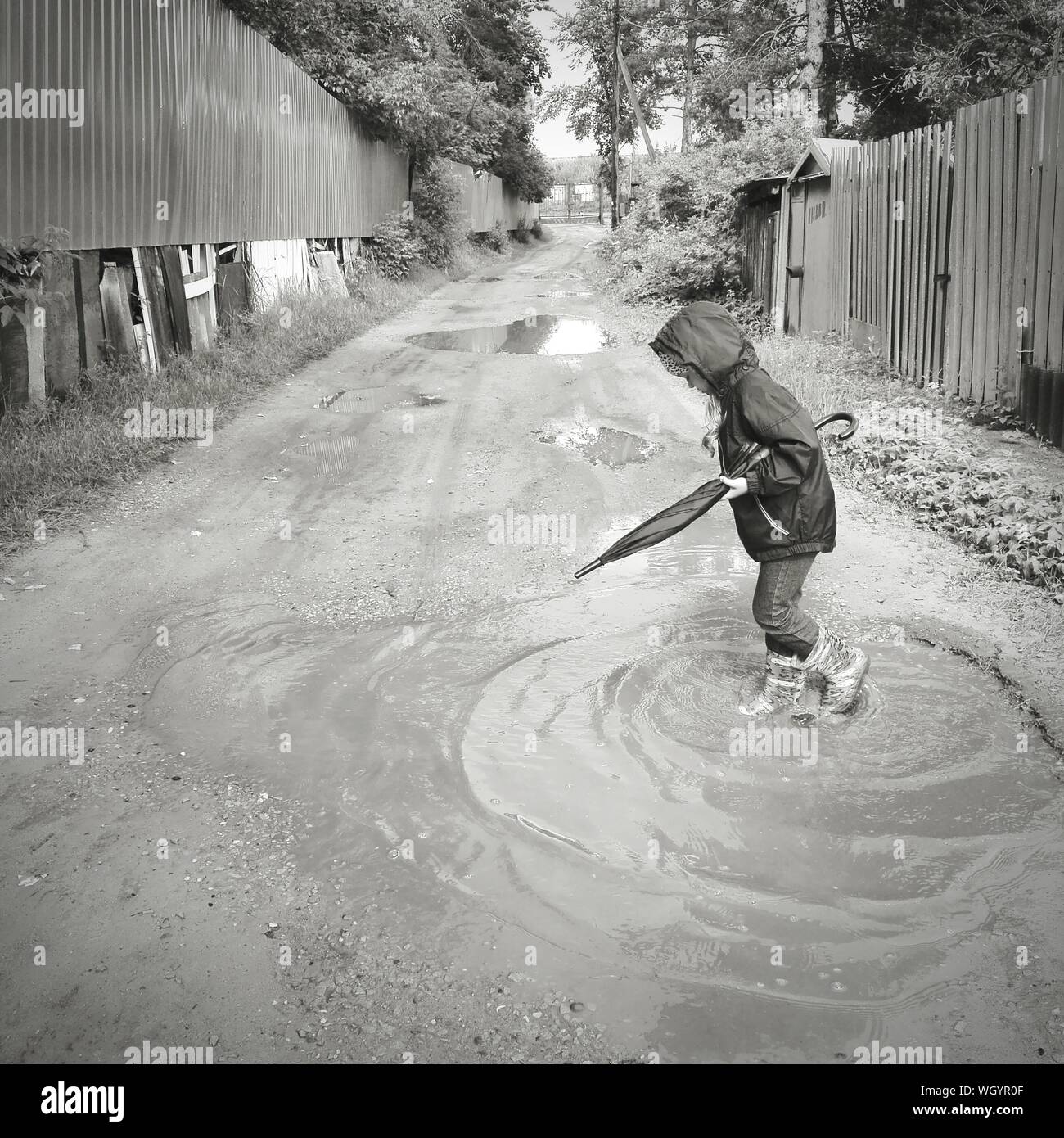 Jumping in mud puddle hi-res stock photography and images - Alamy