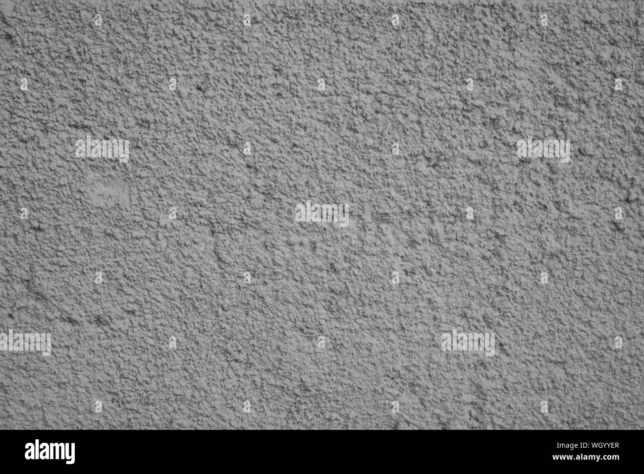 Gritty texture of a white concrete wall. Decorative plaster on the ...