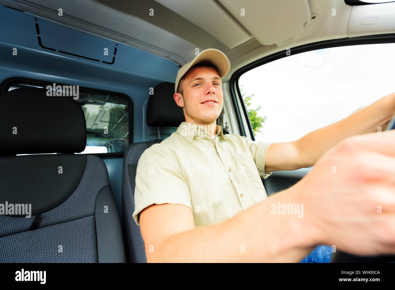 Young man driving vehicle hi-res stock photography and images - Alamy
