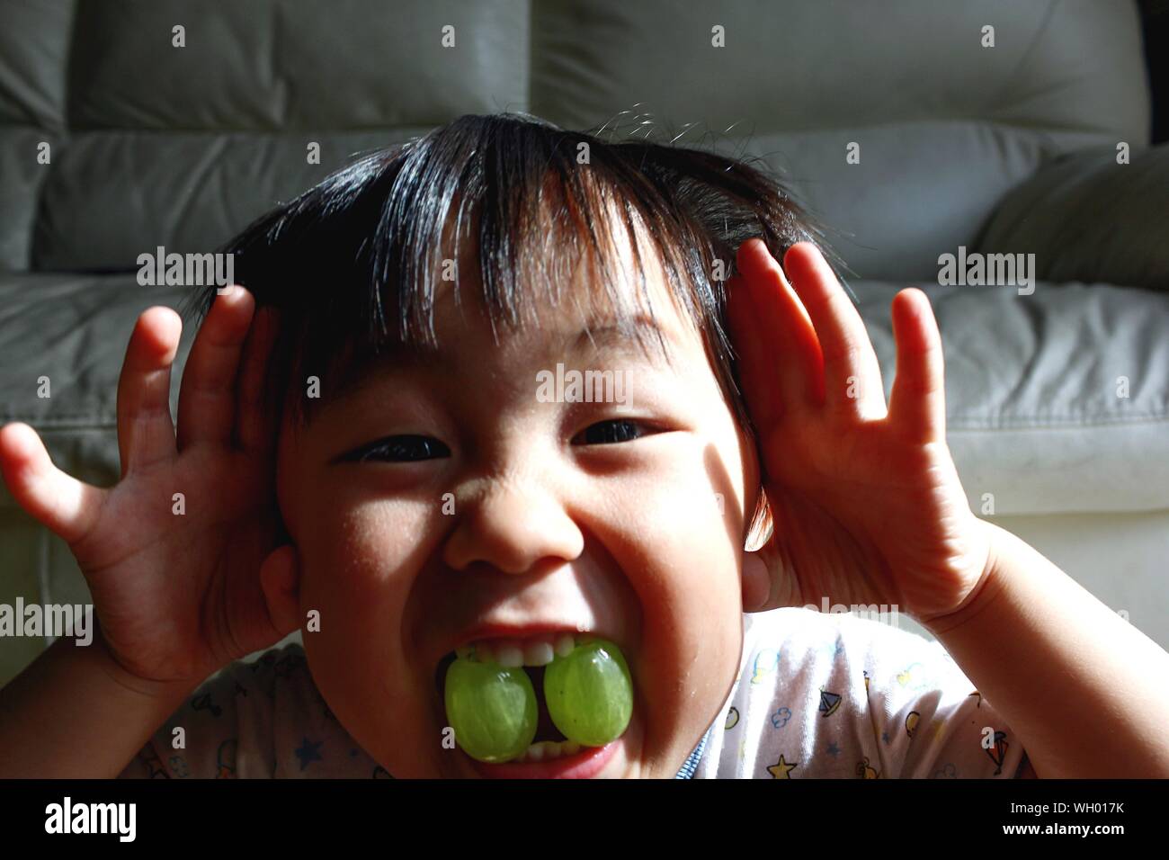 Boy biting food hi-res stock photography and images - Alamy