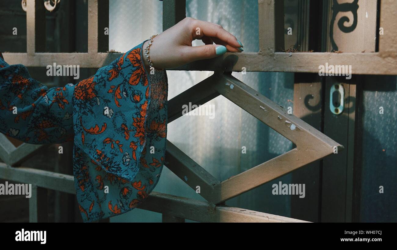 Hand on gate hi-res stock photography and images - Alamy