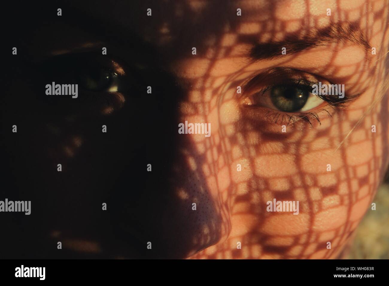 Woman face shadow close up hi-res stock photography and images - Alamy