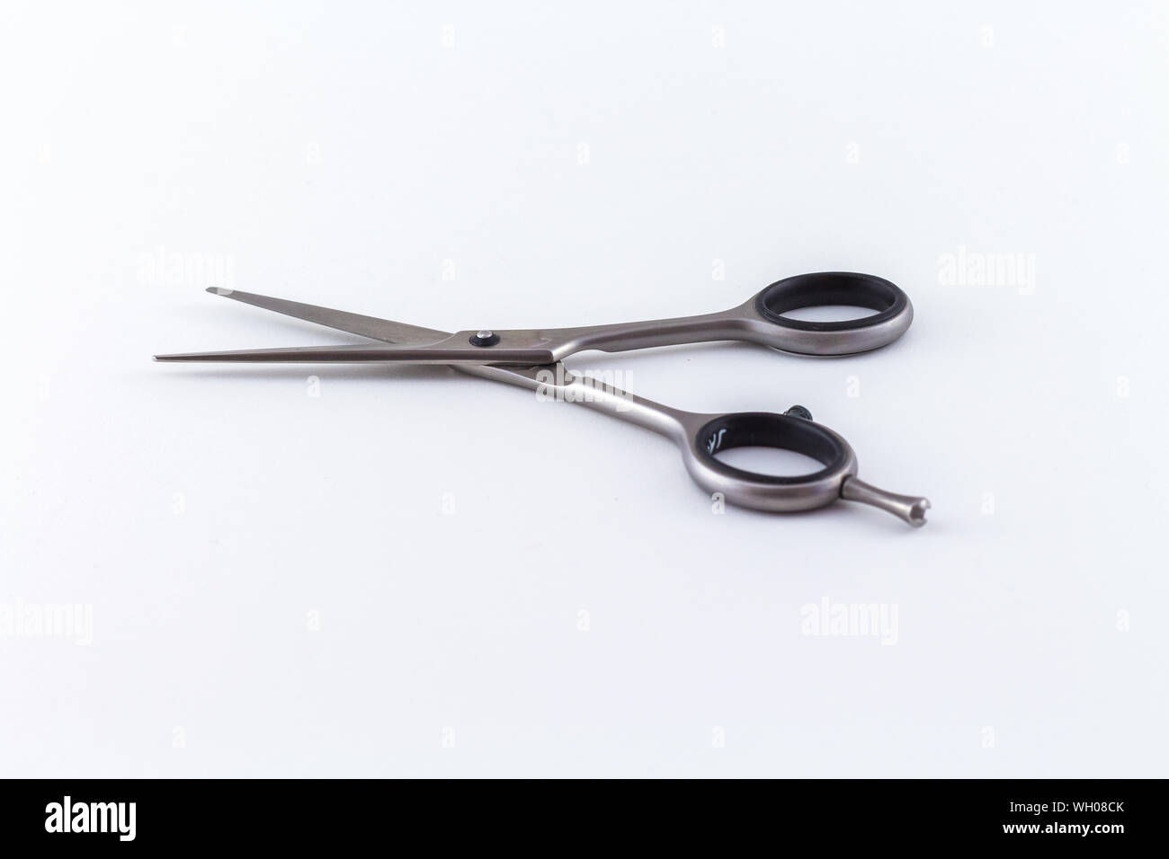 Silver colored scissors hi-res stock photography and images - Alamy
