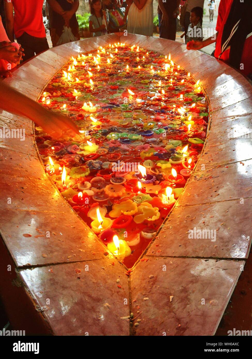 Igniting candles hi-res stock photography and images - Alamy