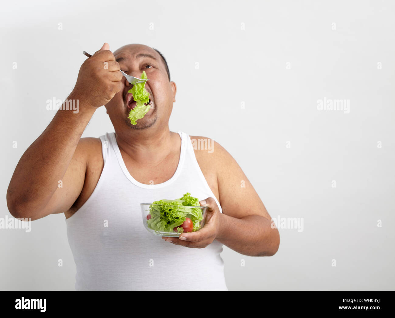 Man eating, white background hi-res stock photography and images - Alamy