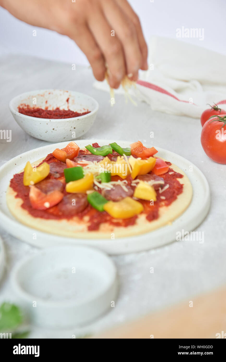 Preparing individual pizzas from pizza bar Stock Photo - Alamy