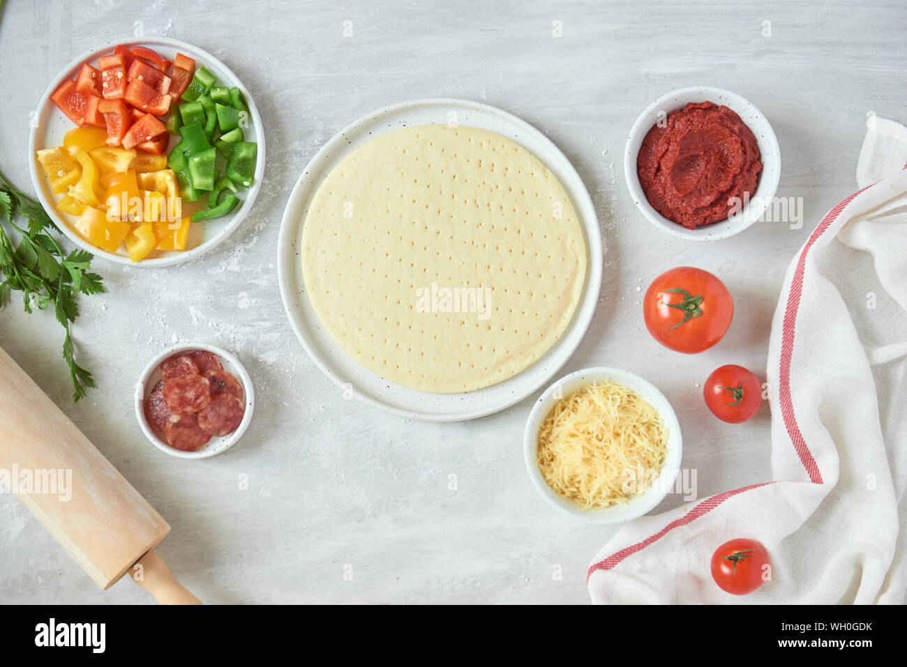 Preparing individual pizzas from pizza bar Stock Photo - Alamy