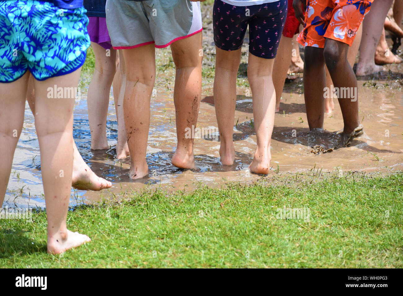 Children playing in puddle hi-res stock photography and images - Alamy