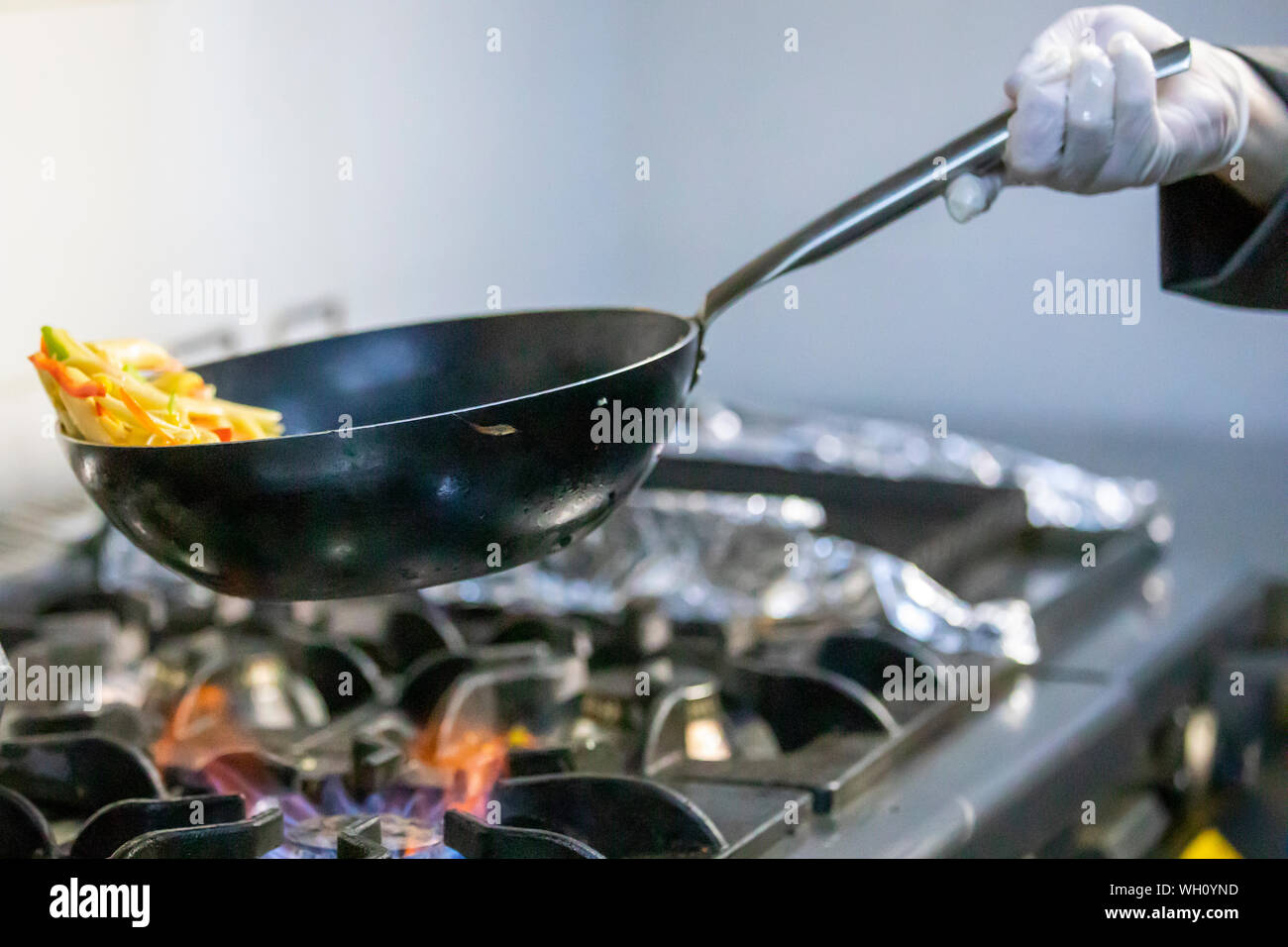 Chef stirring food hi-res stock photography and images - Alamy