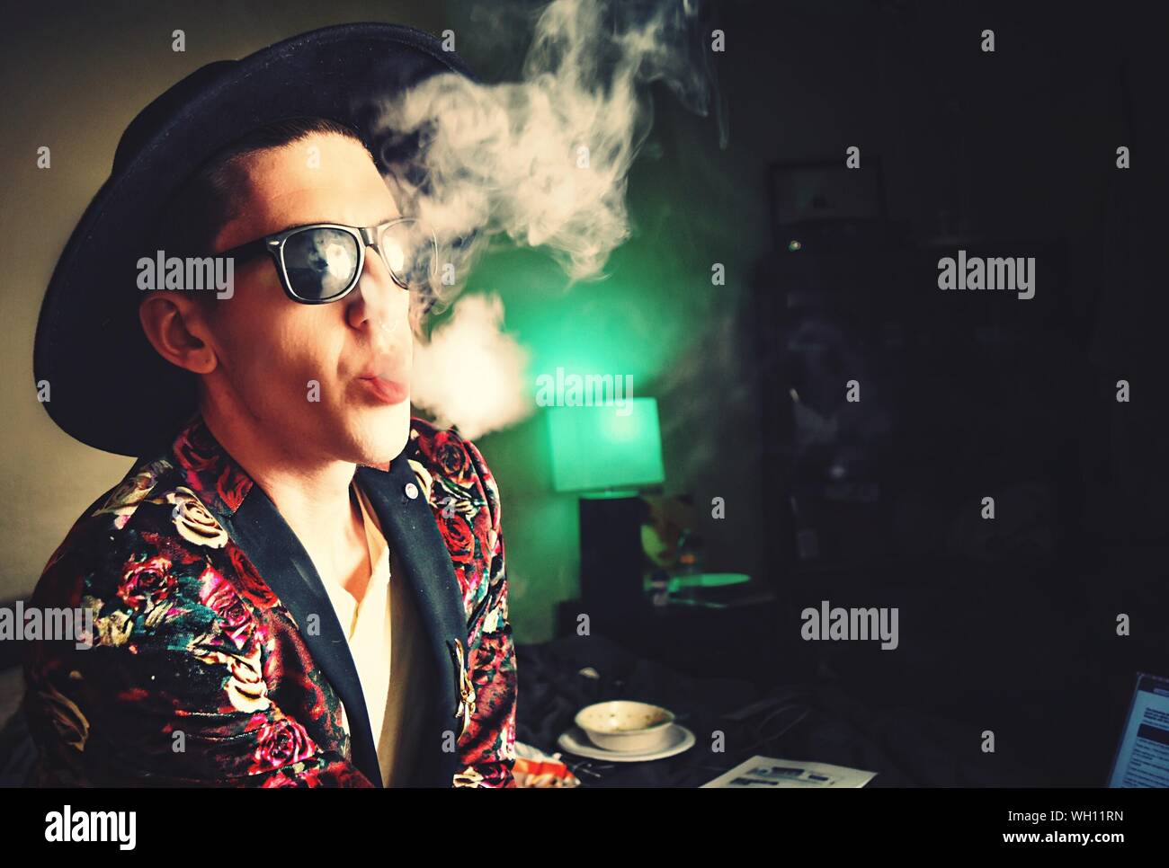 Man exhaling smoke hi-res stock photography and images - Alamy
