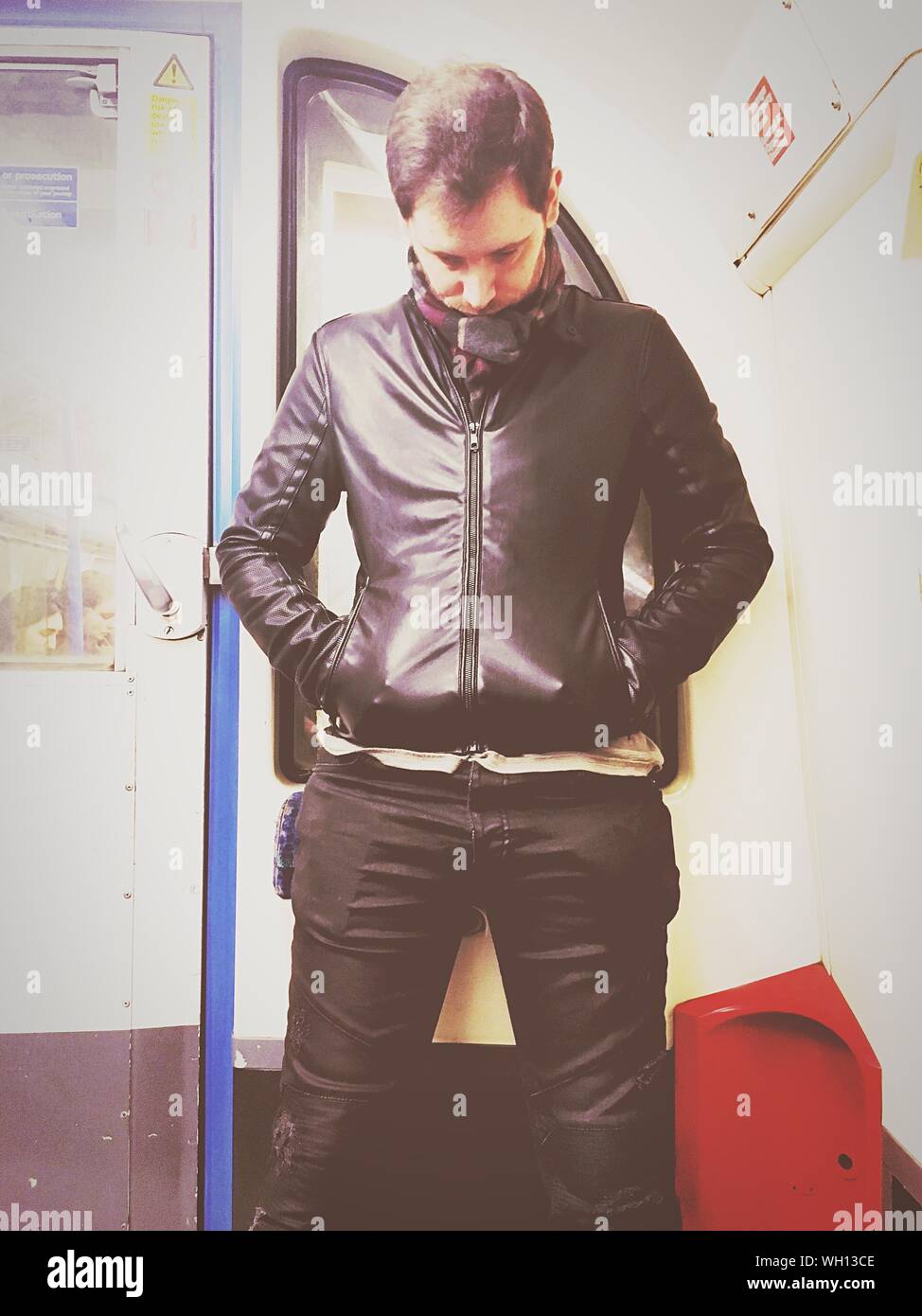 People standing in train commuter hi-res stock photography and images ...