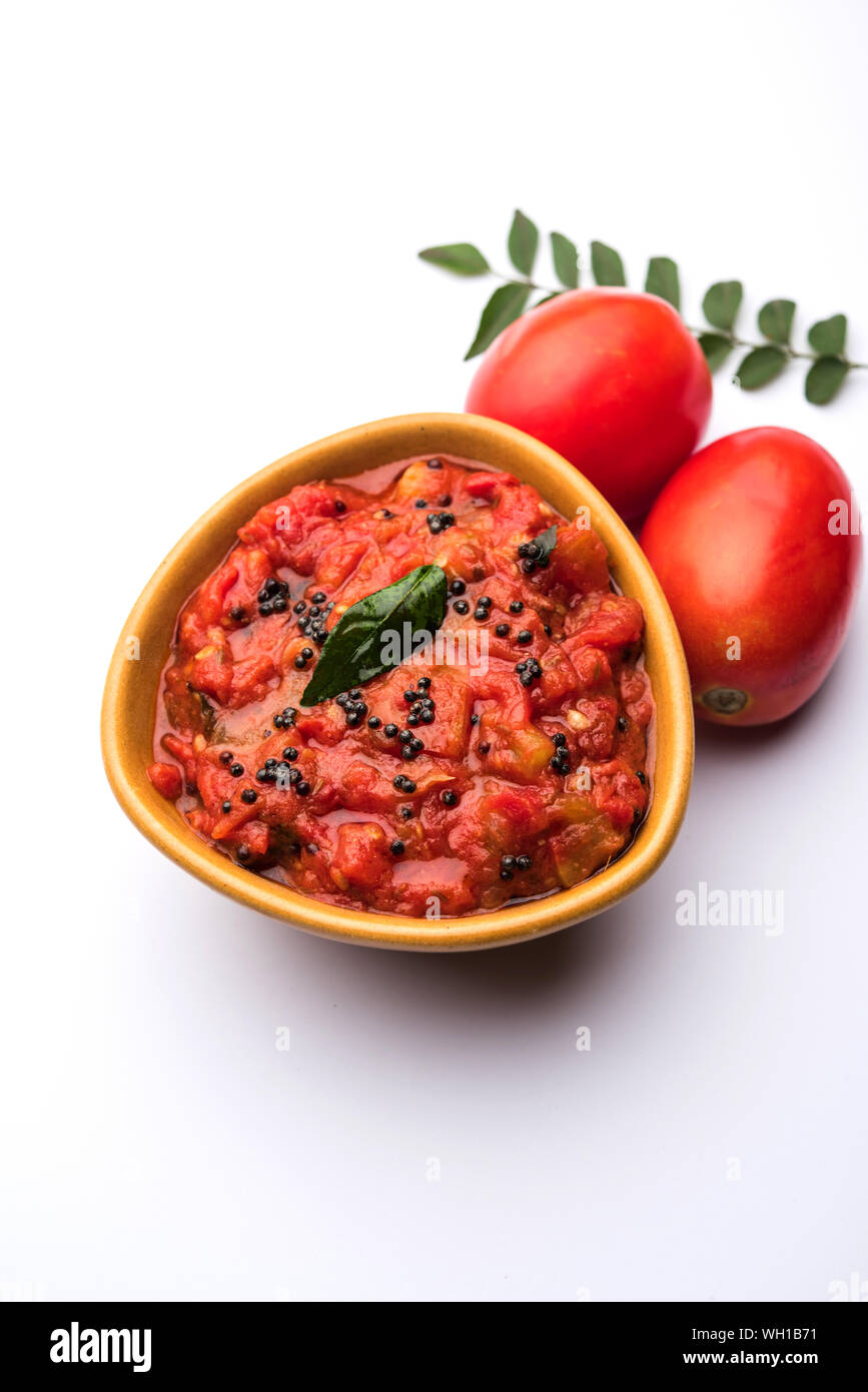 Tomato/tamatar chutney or sauce, served in a bowl. selective focus ...