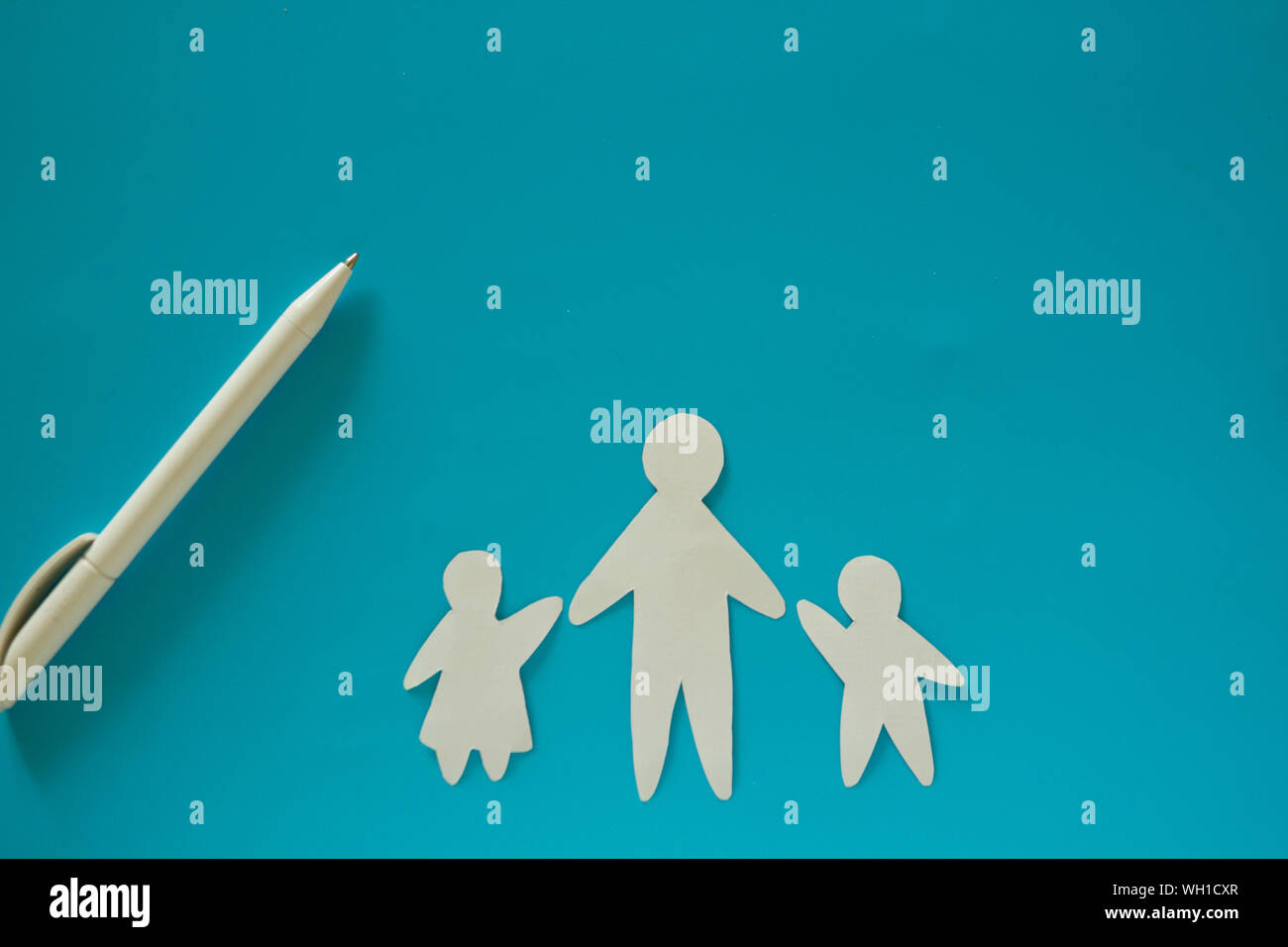 Single father concept image. Paper father with children Stock Photo - Alamy