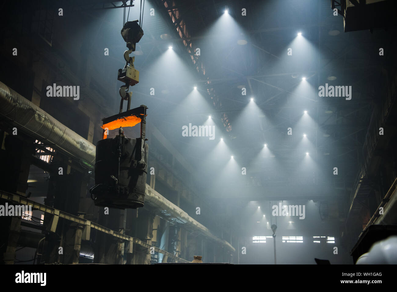 Ladle with hot metal on a crane at steel factory Stock Photo - Alamy