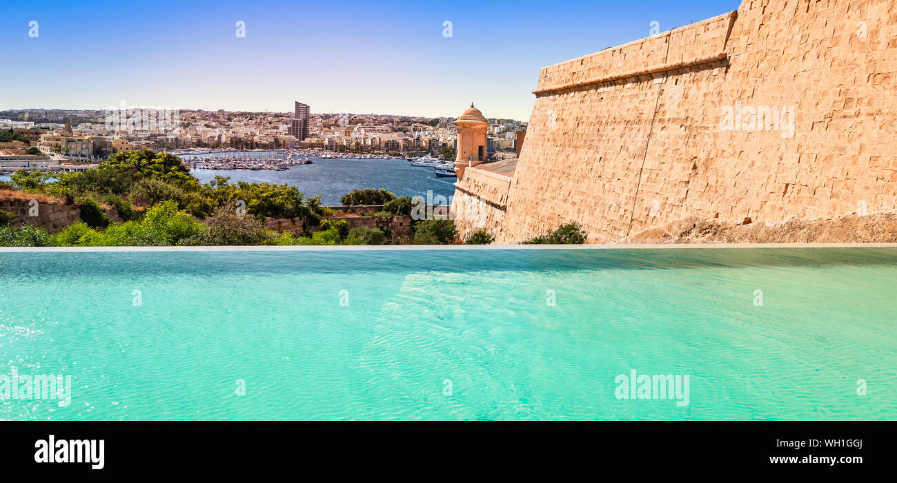 Infinity pool overlooking the city of Valletta, Malta Stock Photo - Alamy