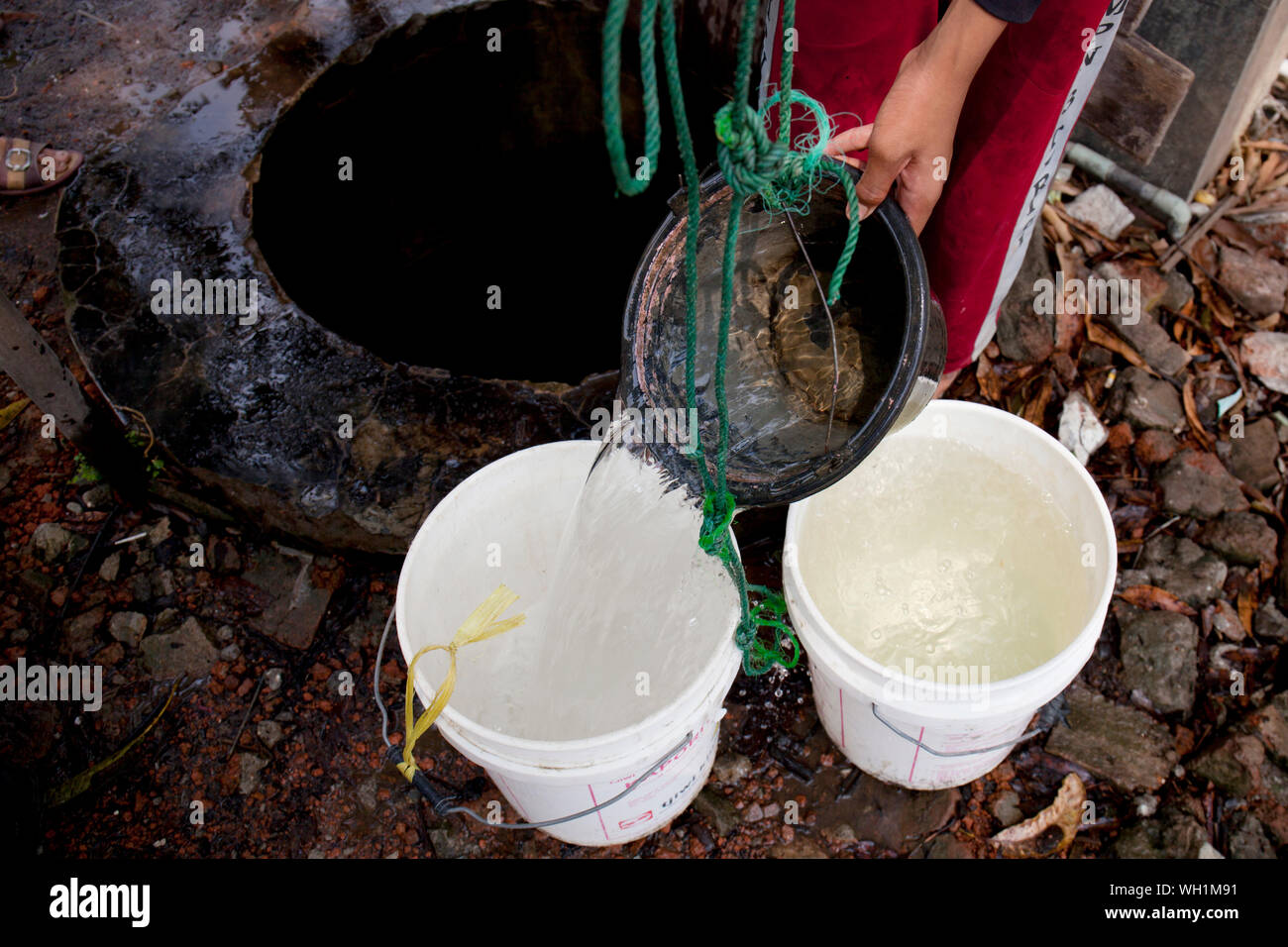 Pouring water bucket hi-res stock photography and images - Alamy