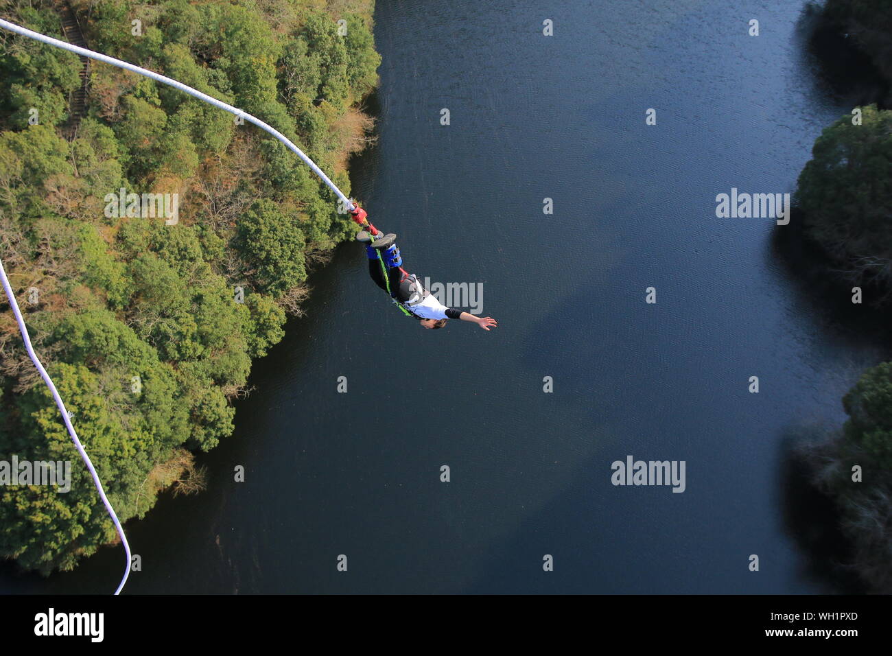 Man jumping over river hi-res stock photography and images - Alamy