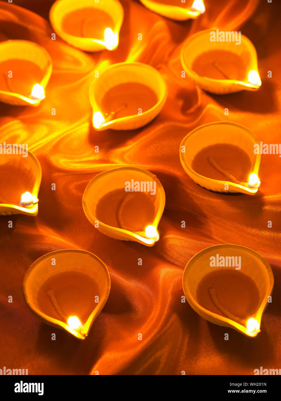 Indian People Lighting Diyas High Resolution Stock Photography and ...