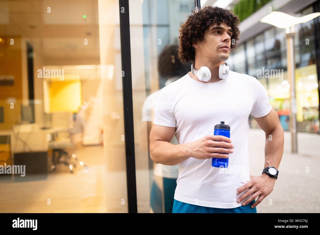 Handsome male jogger drinking water hi-res stock photography and images ...