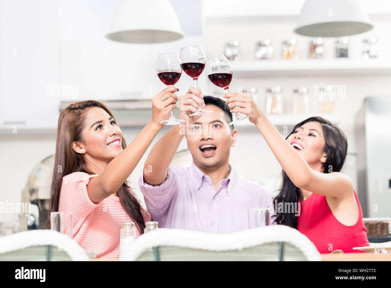 Young happy woman raising toast hi-res stock photography and images - Alamy
