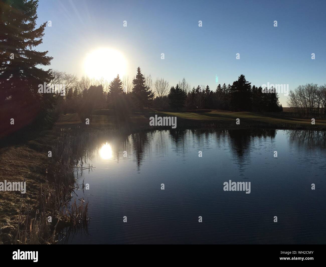 Sun shining over water lake hi-res stock photography and images - Alamy