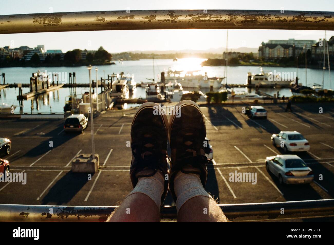 Man on railing hi-res stock photography and images - Alamy