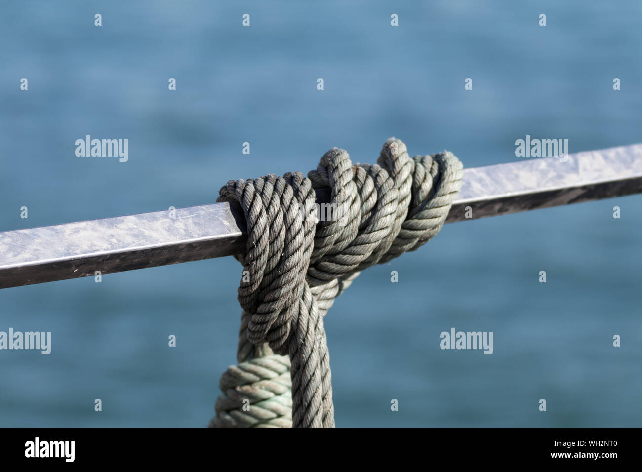 Close-up Of Rope Tied On Metal Railing Stock Photo - Alamy