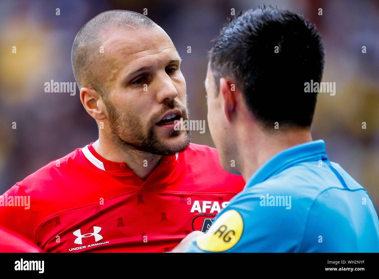 Football referee talking player hi-res stock photography and images - Alamy