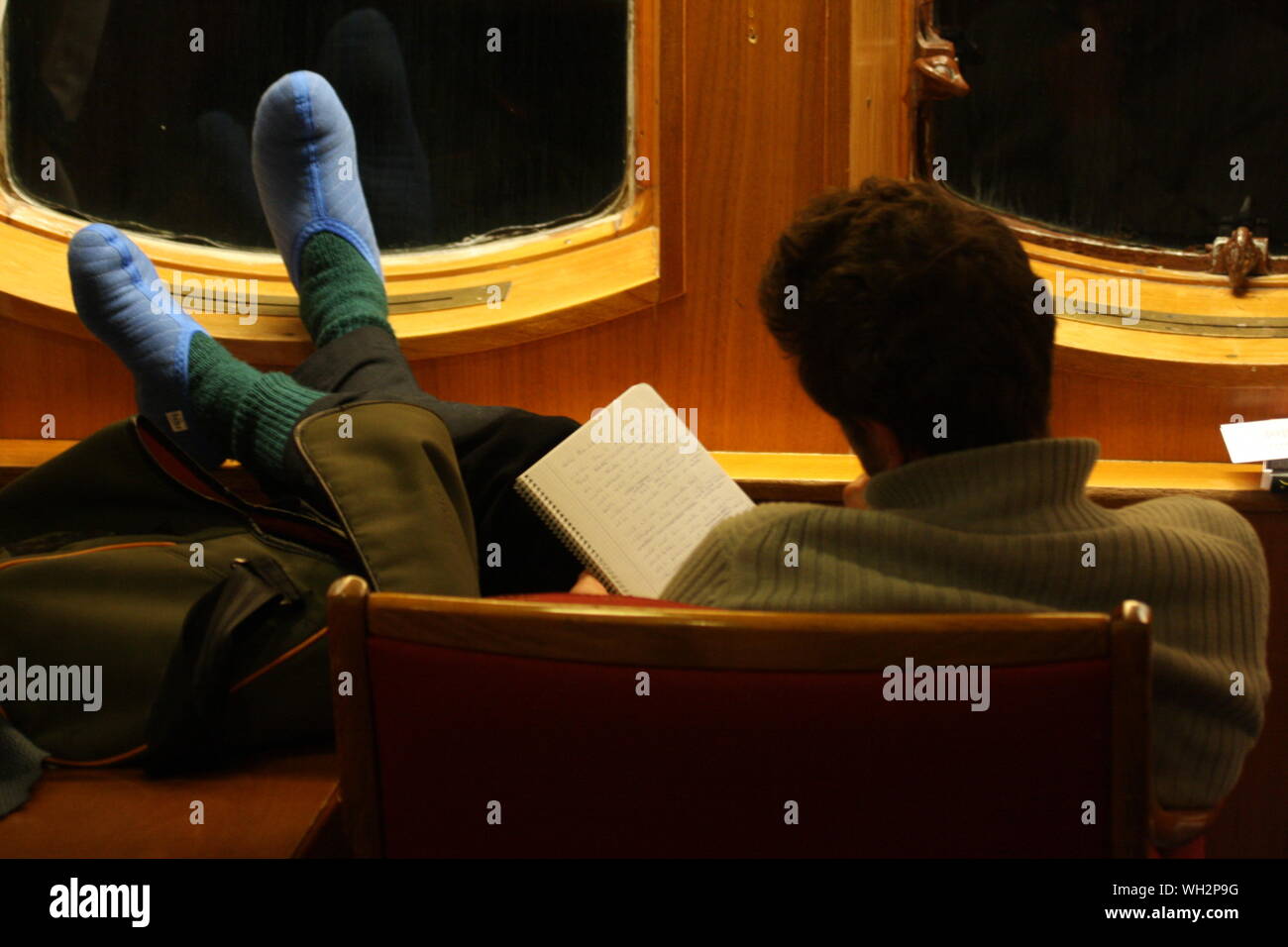 Man sitting on chair reading hi-res stock photography and images - Alamy