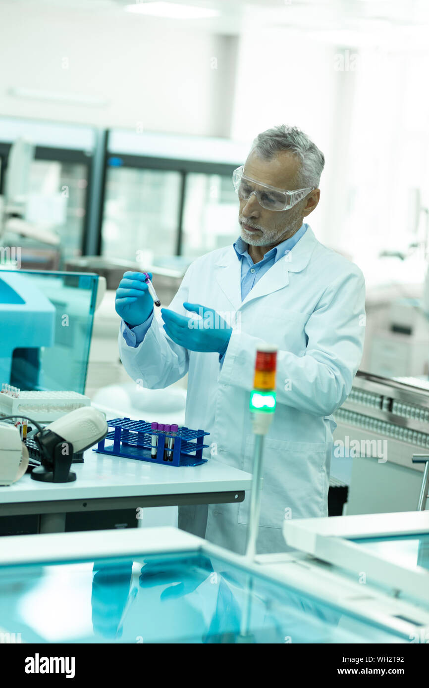 Serious scientist working in health and medicine sphere Stock Photo - Alamy