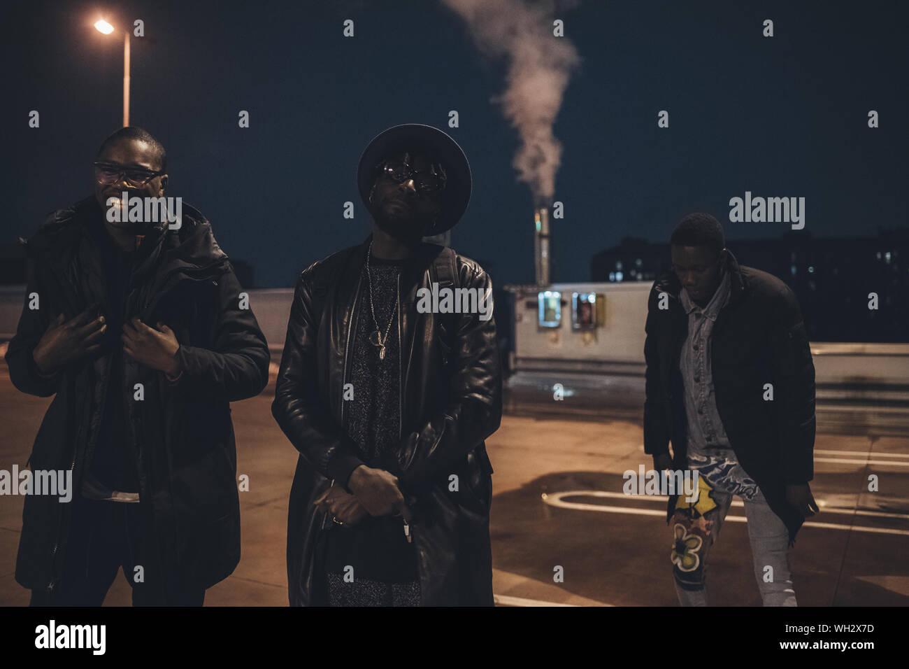 three young men posing outdoor looking camera serious - rap crew, gang ...