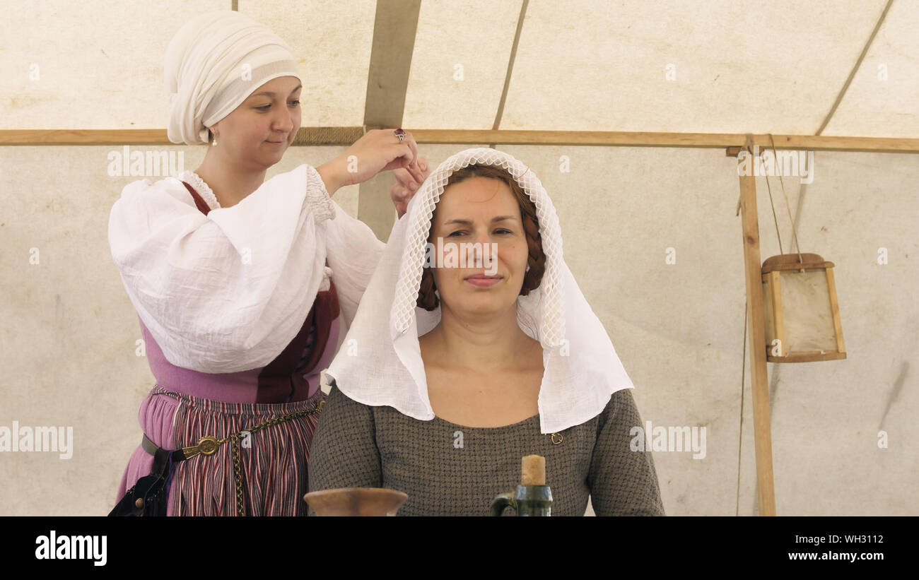 Three medieval woman sewing. They dressed in medieval clothes Stock ...