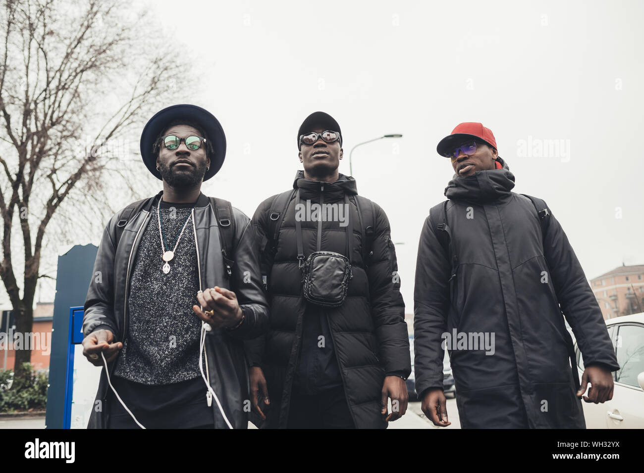 three young african men walking in the street together – relationship ...