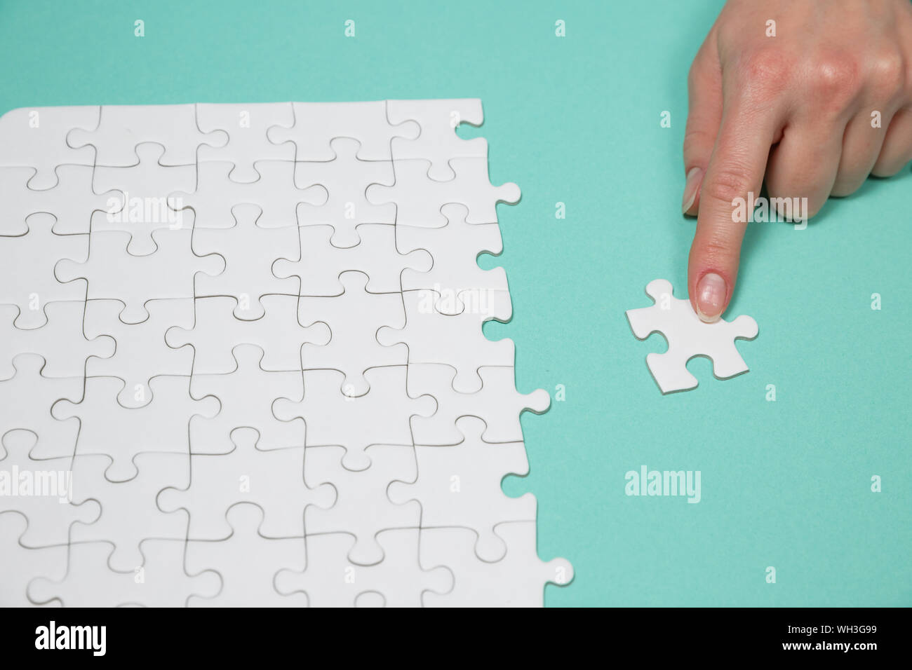 Hands assembling jigsaw puzzle, to find common solution concept Stock ...