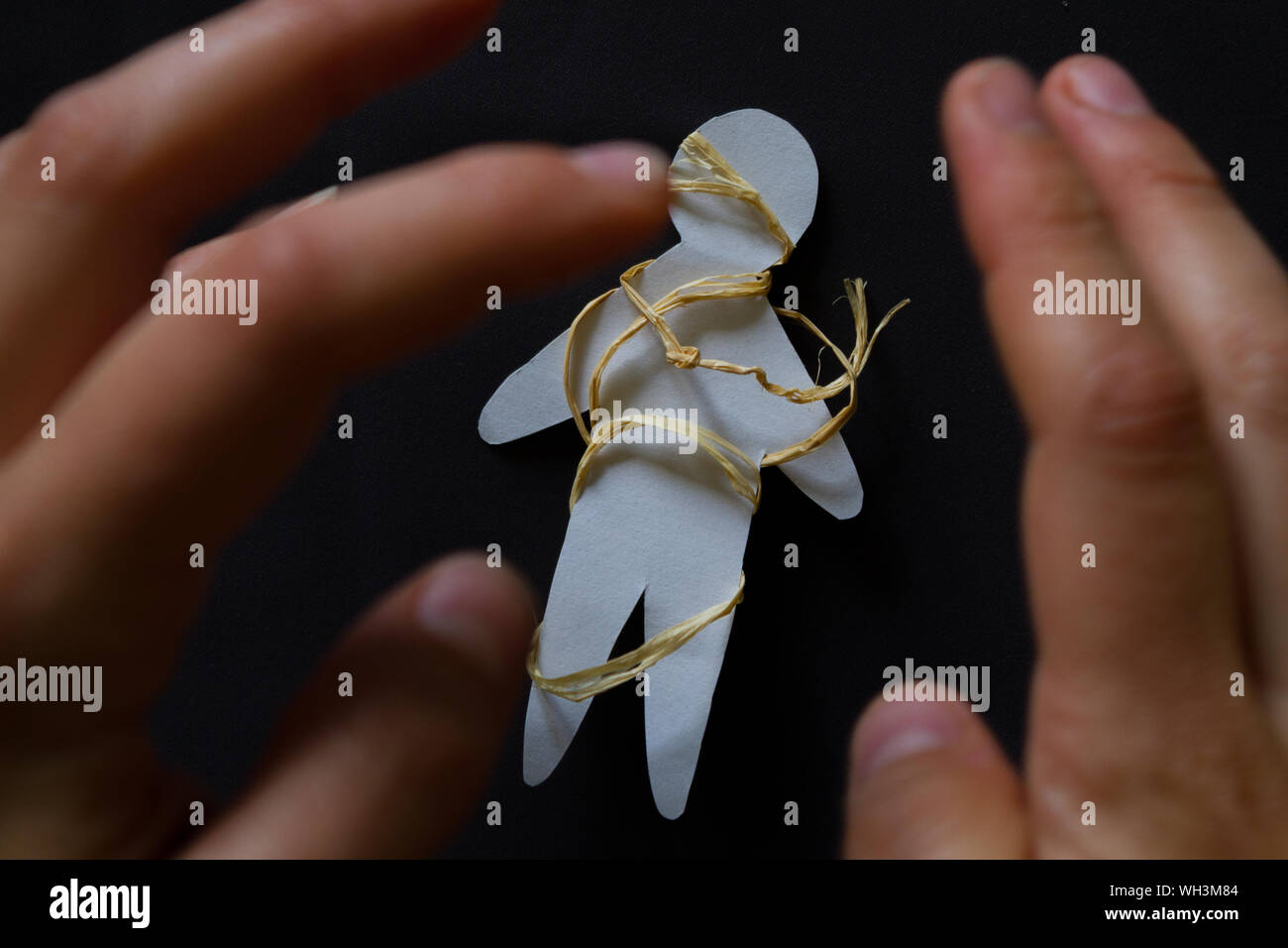 Voodoo Doll on black background. Curse concept Stock Photo - Alamy
