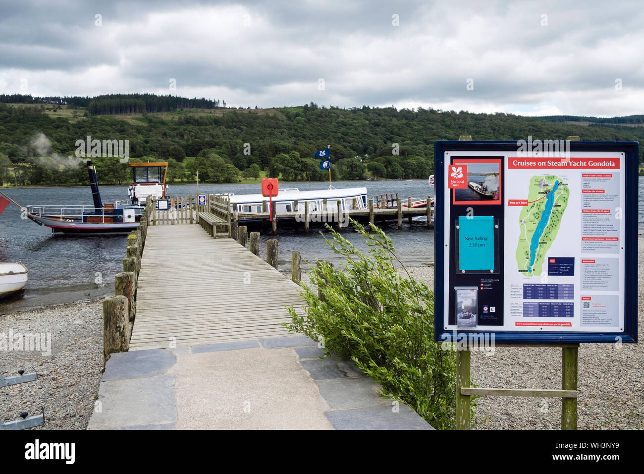 Sign for Coniston Launch steam yacht Gondola moored at jetty on ...