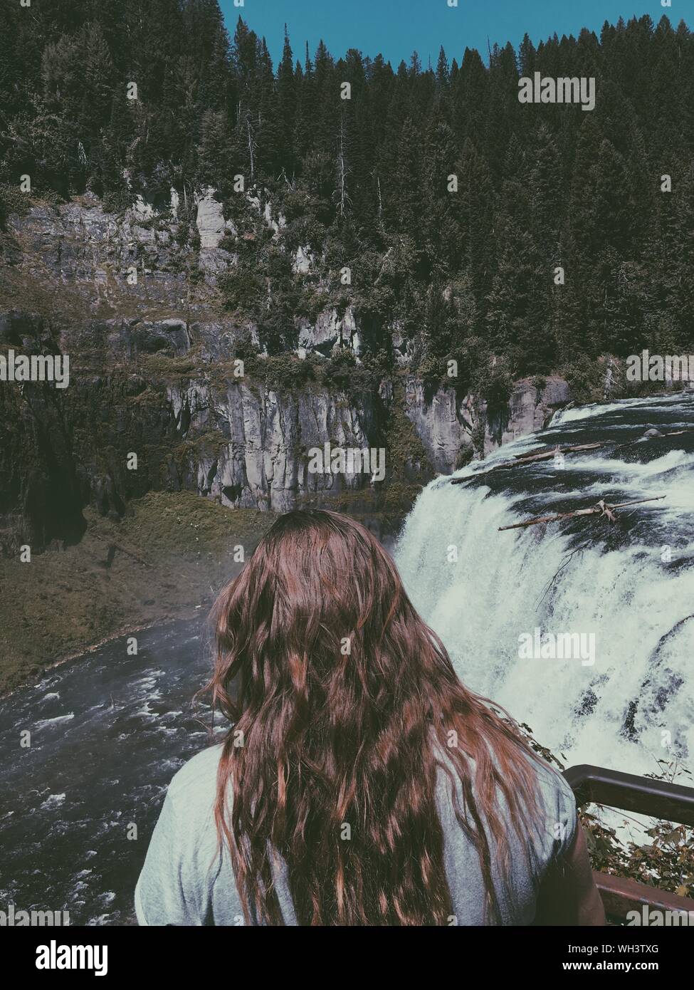 Rear view woman looking waterfall hi-res stock photography and images ...