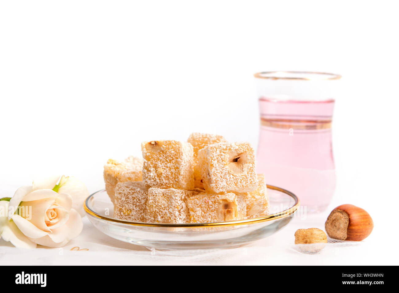 Turkish delight dessert with hazelnuts served with rose tea Stock Photo ...