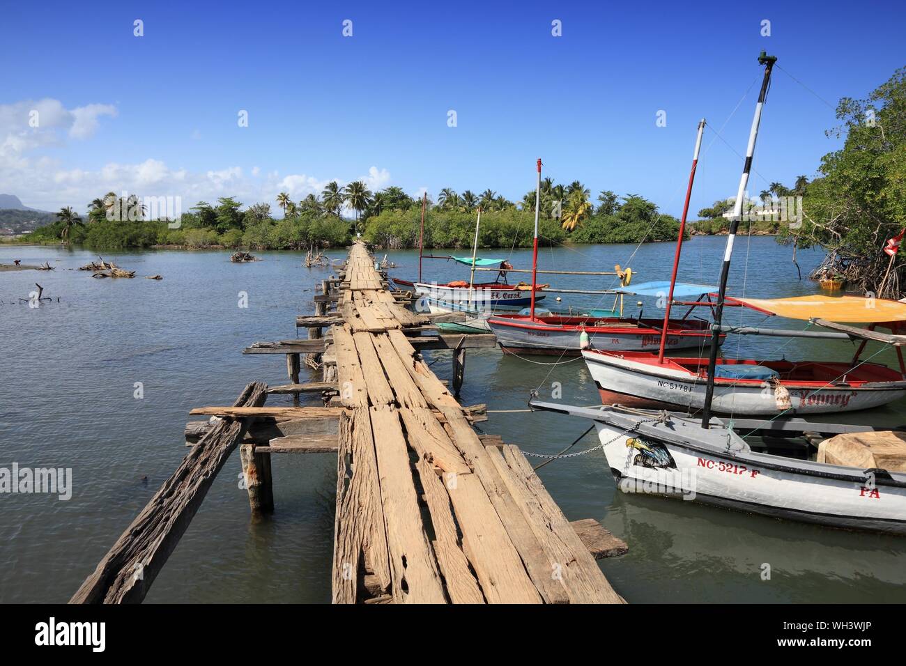 BARACOA, CUBA - FEBRUARY 12, 2011: Boats by Rio Miel footbridge in ...
