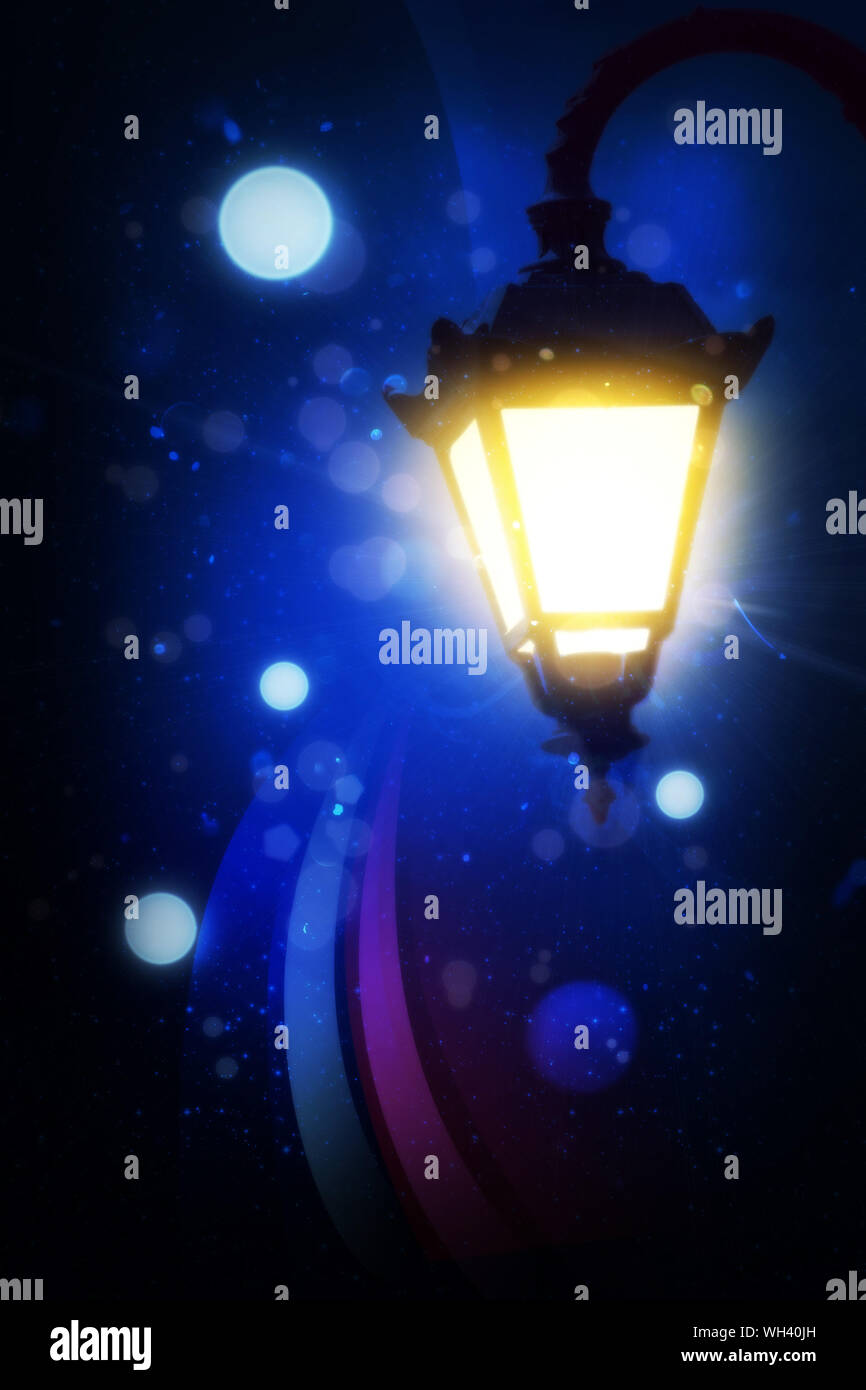 Lit up street lamp with bokeh texture and stars, close up, photo ...