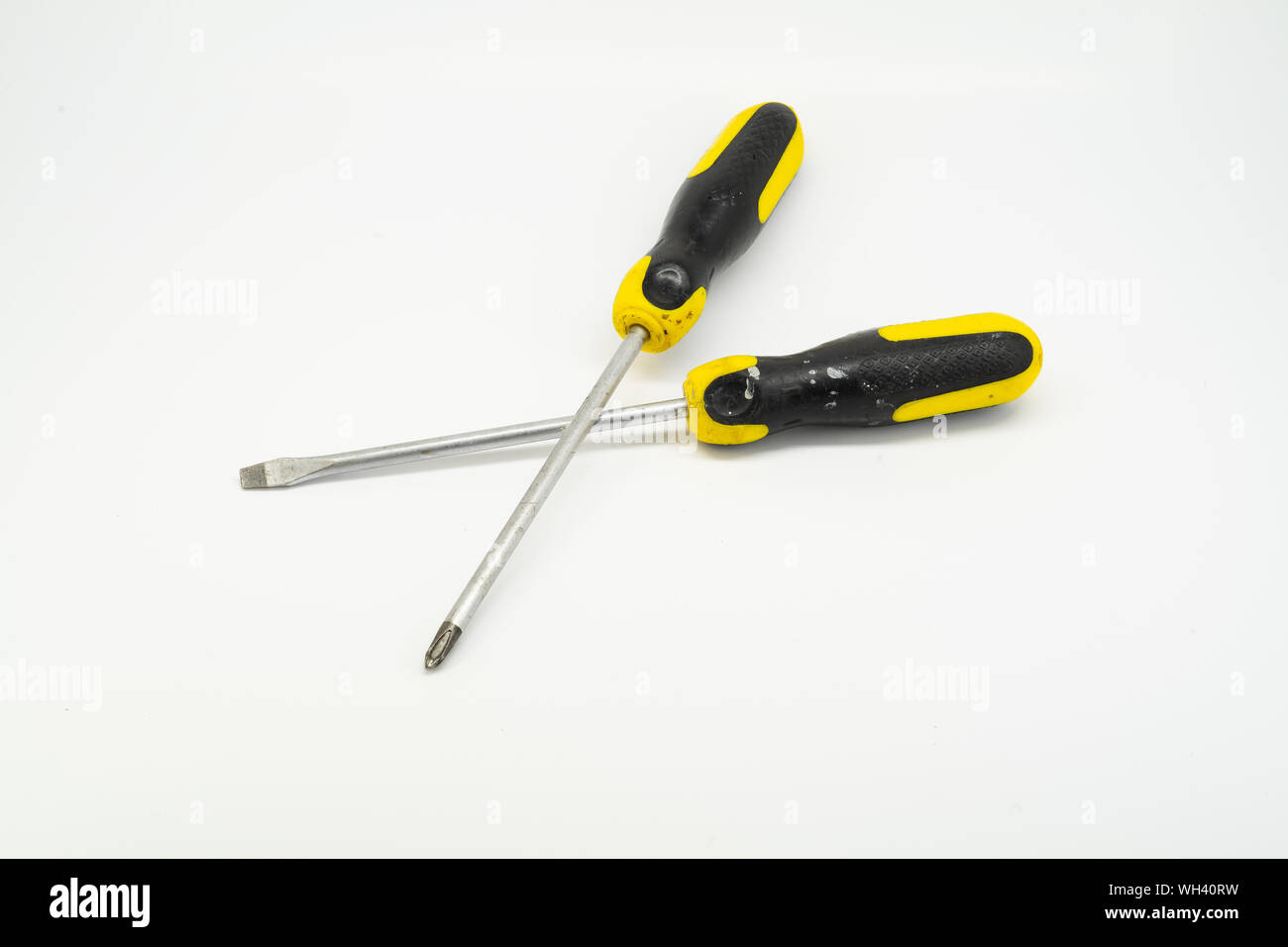 Yellow screwdrivers isolated on white background Stock Photo - Alamy