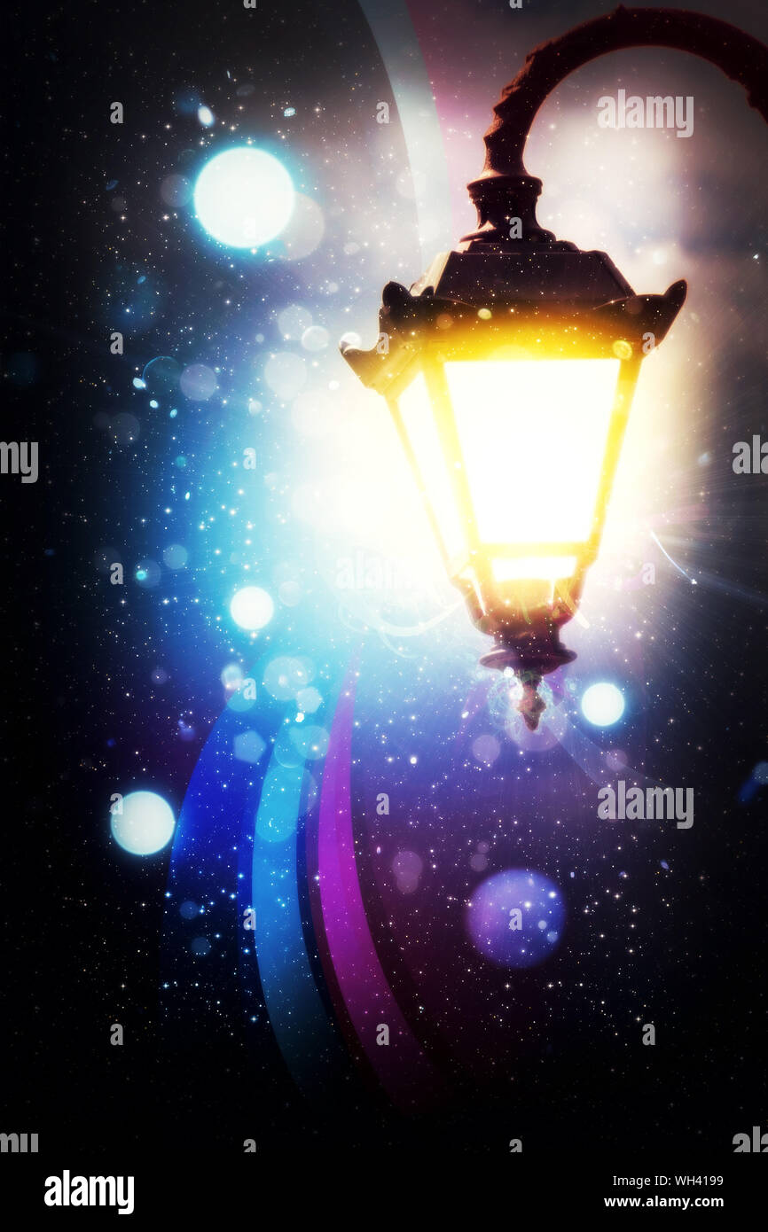 Lit up street lamp with bokeh texture and stars, close up, photo ...