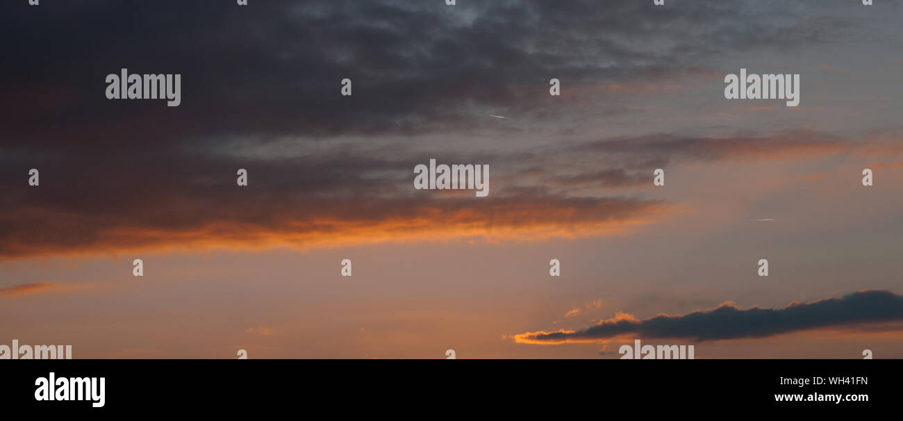 Sky background sunset sunrise with soft clouds Stock Photo - Alamy