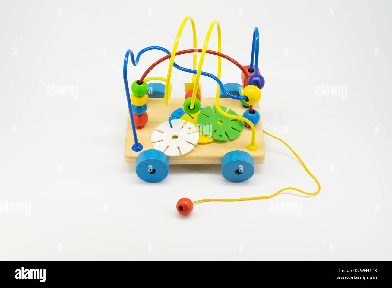 Colourful wooden toy car with string puller isolated on white ...