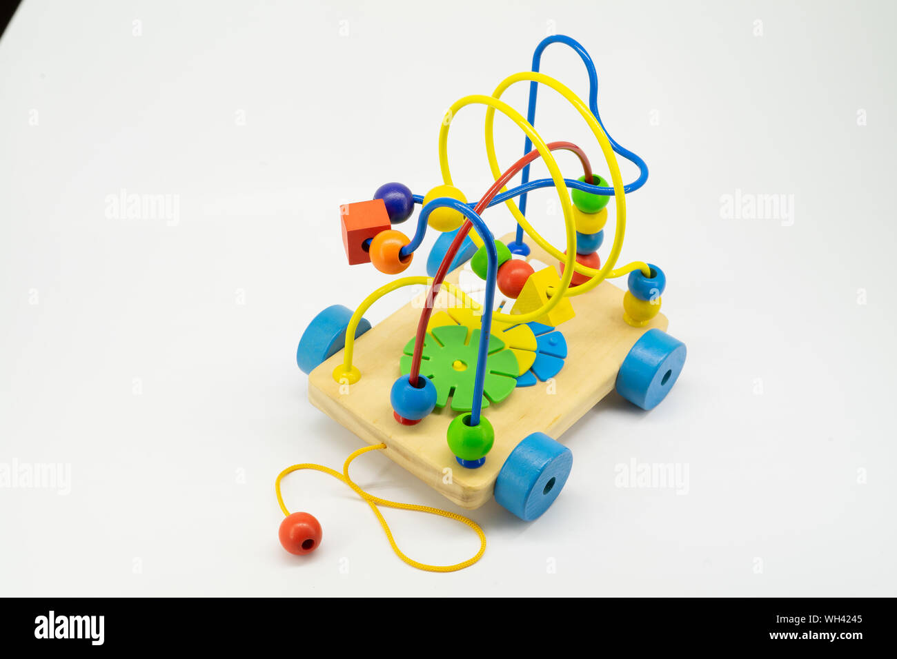 Colourful wooden toy car with string puller isolated on white ...