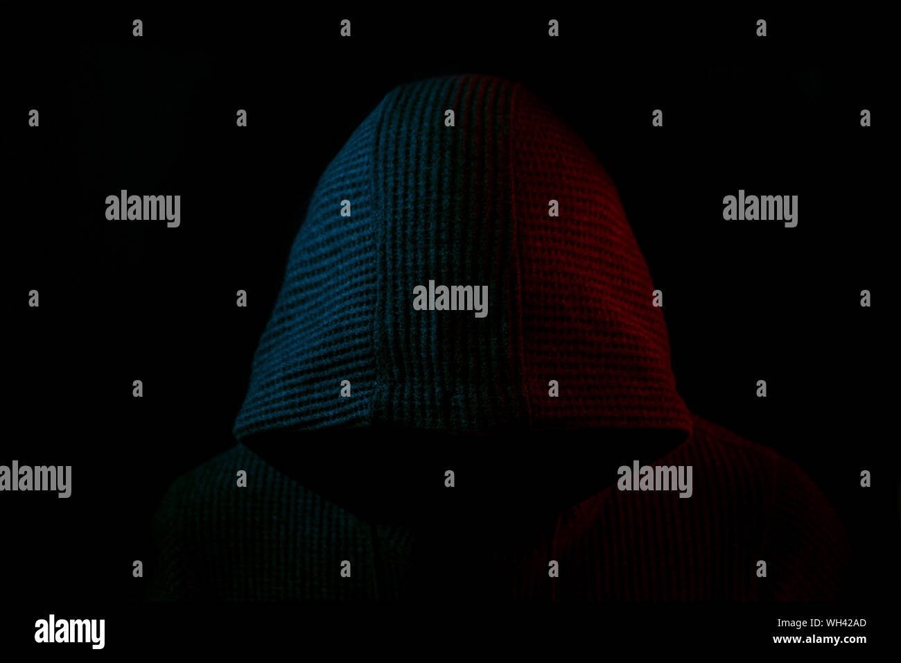 Portrait of Invisible man in the hood on black background Stock Photo ...